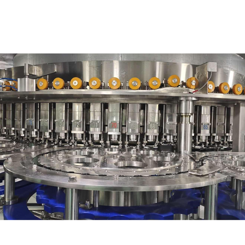 Glass bottle filler and crowner - Gulfood Manufacturing 2025
